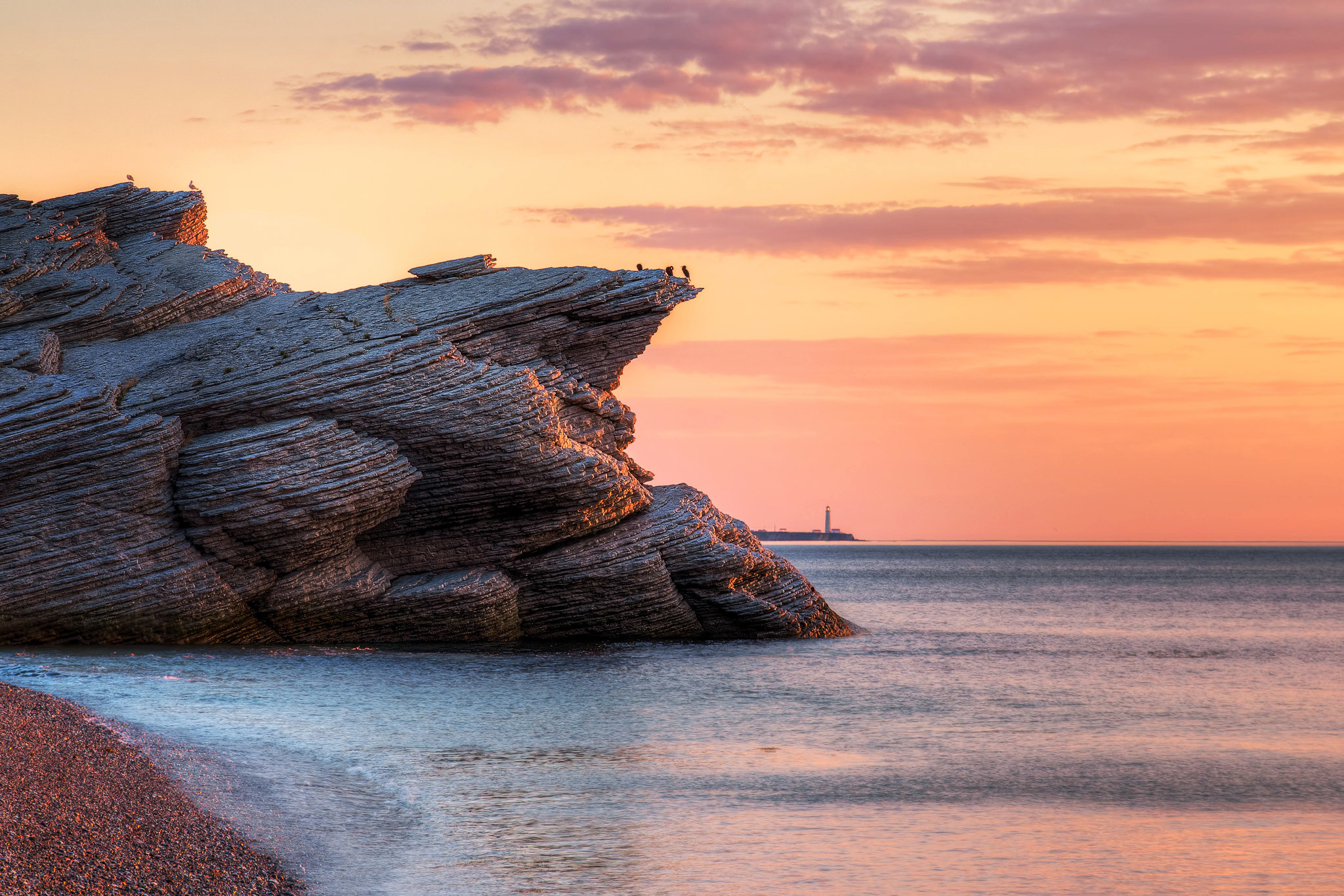 Tranquil sunset over the cliffs of eastern Quebec in Cap Bon Ami ...